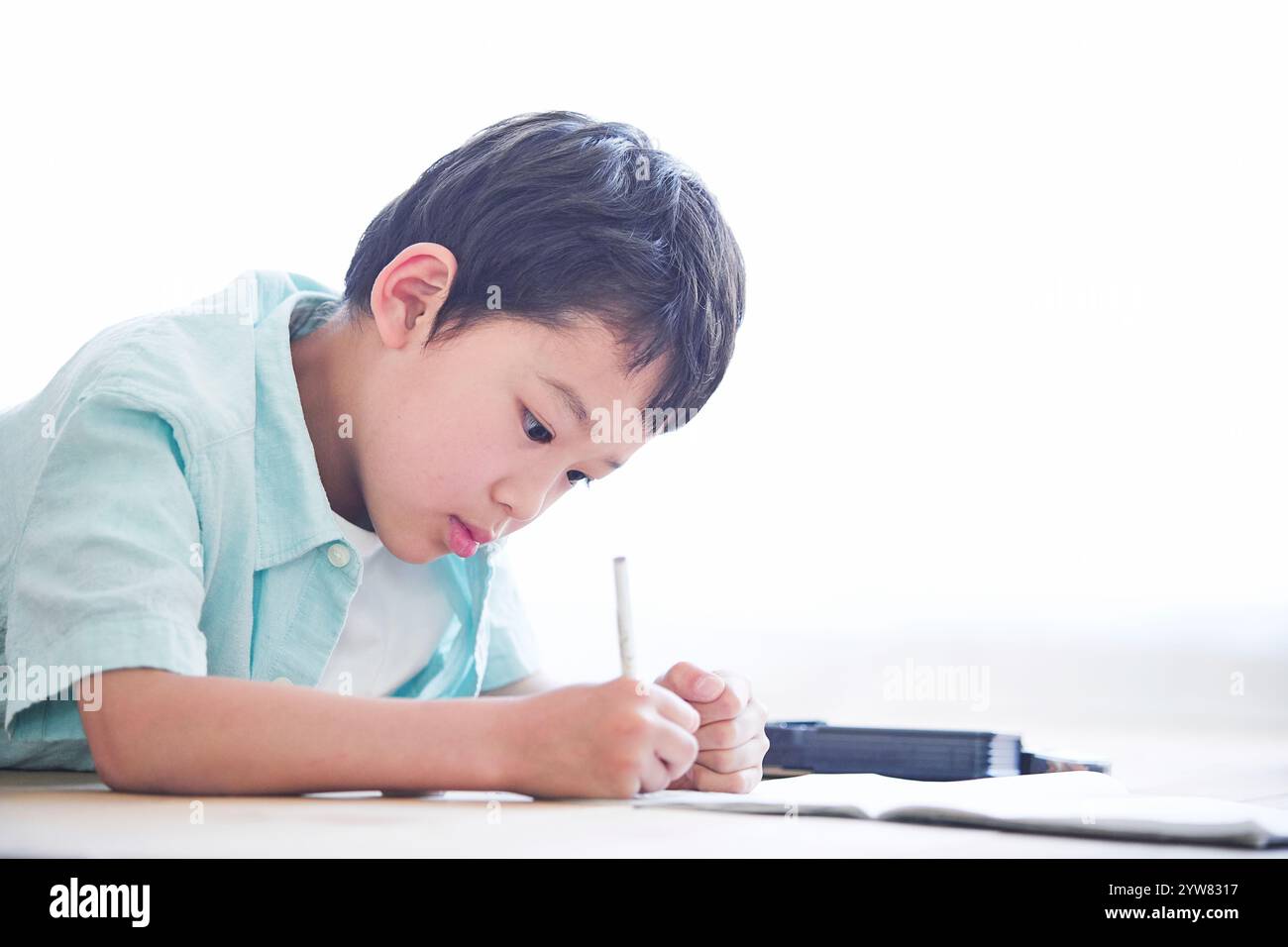 Boy with pen Stock Photo - Alamy