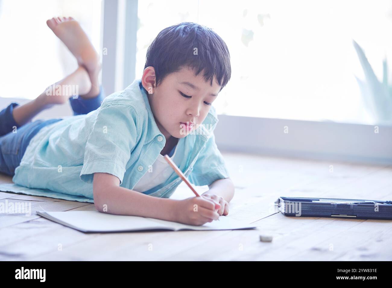 Boy with pen Stock Photo - Alamy