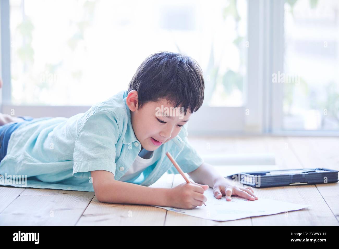 Boy with pen Stock Photo - Alamy