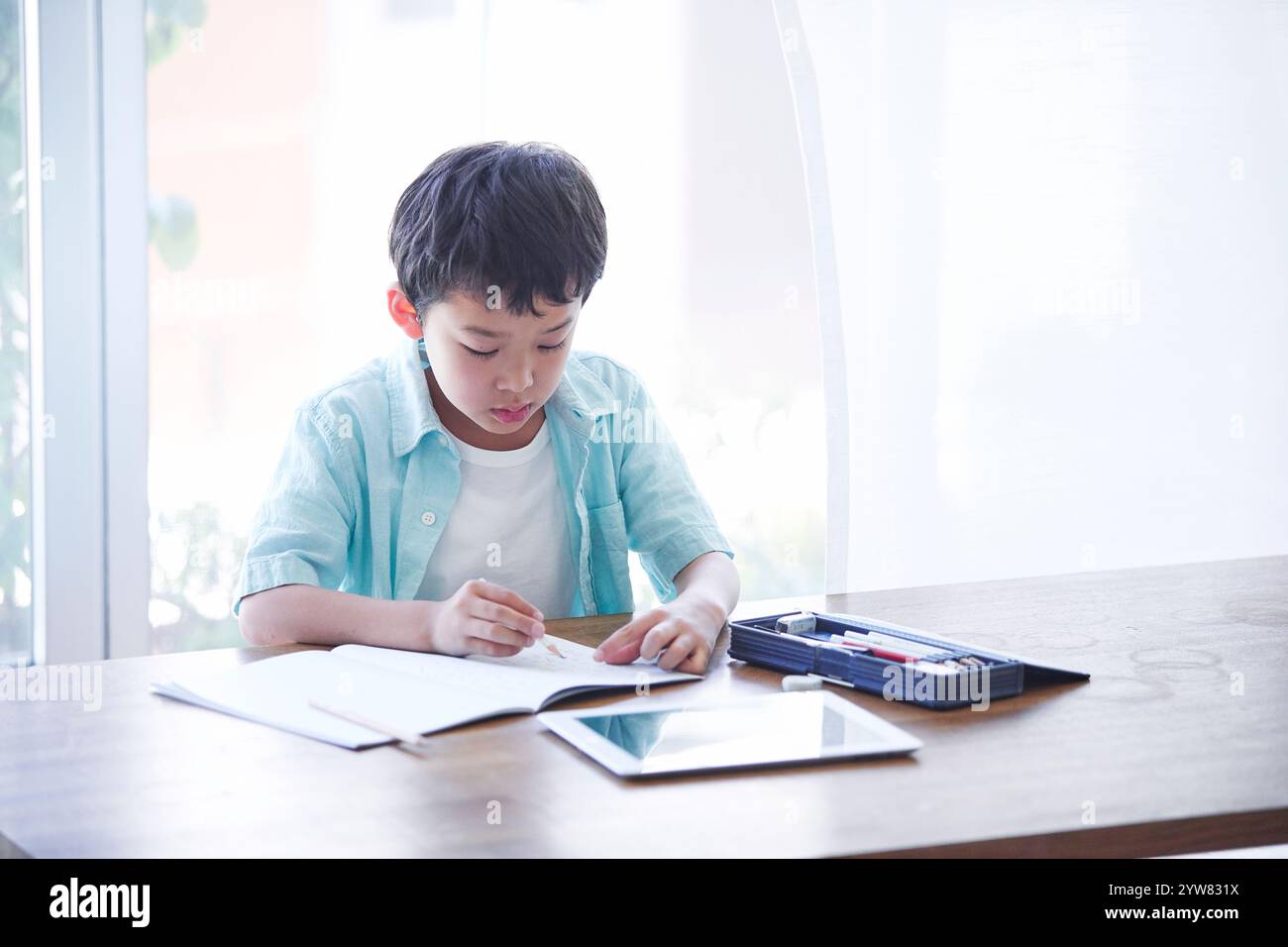Boy with pen Stock Photo - Alamy