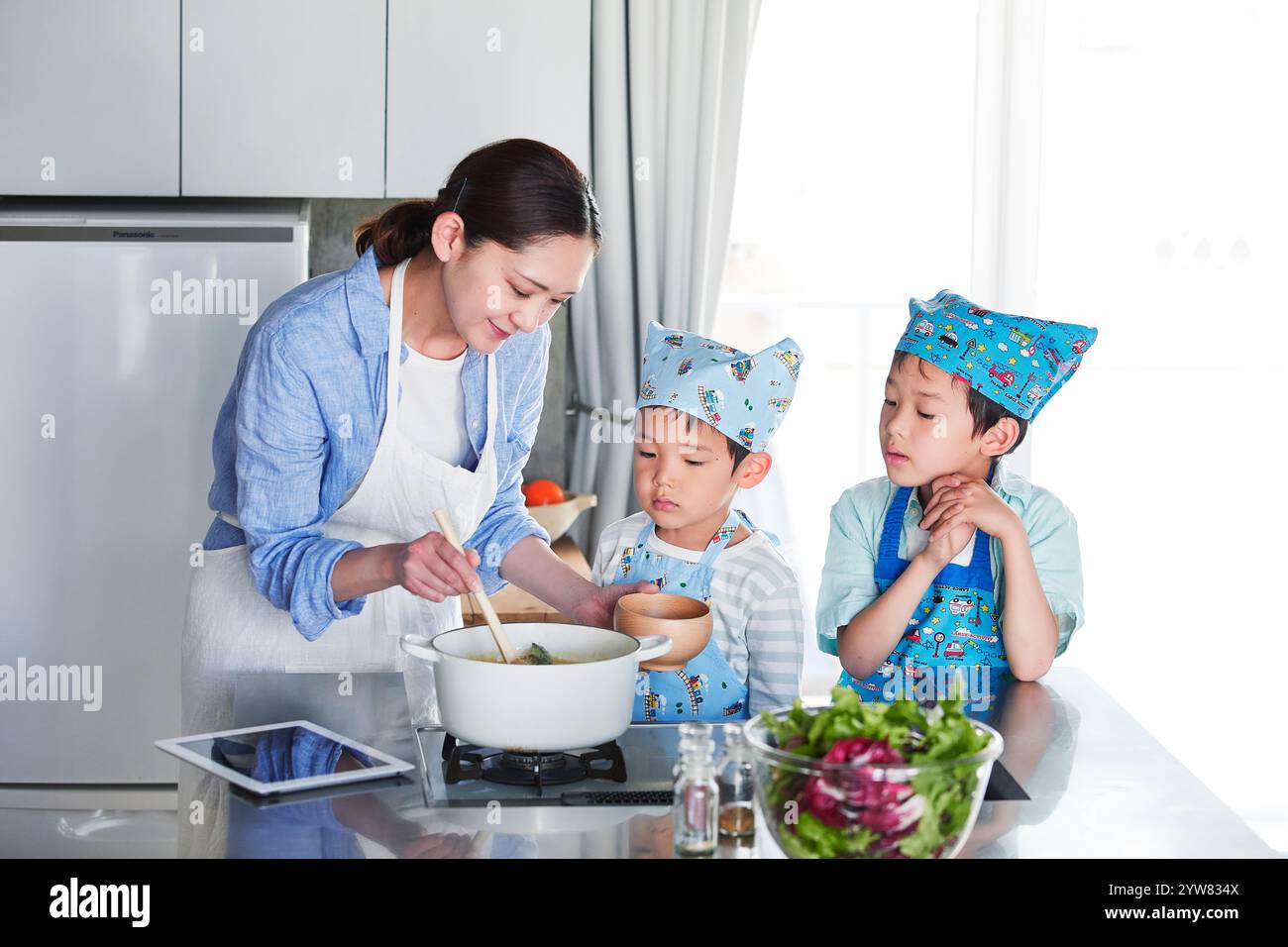 Woman cooking over pot hi-res stock photography and images - Alamy