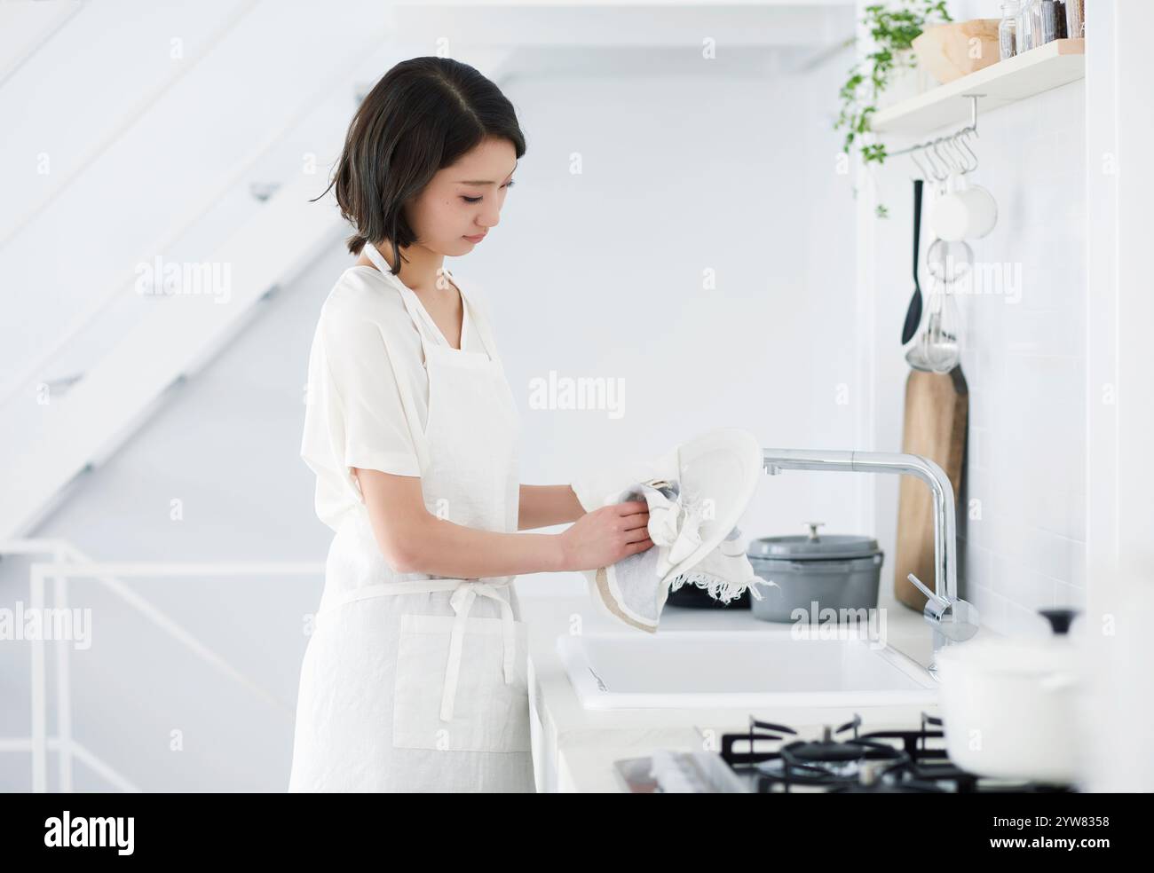 Woman doing housework Stock Photo - Alamy