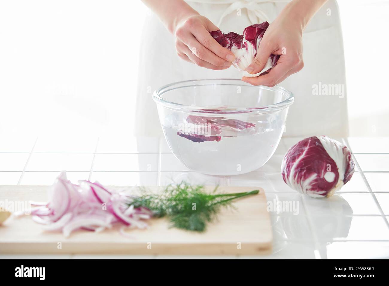 Woman cooking in kitchen Stock Photo - Alamy