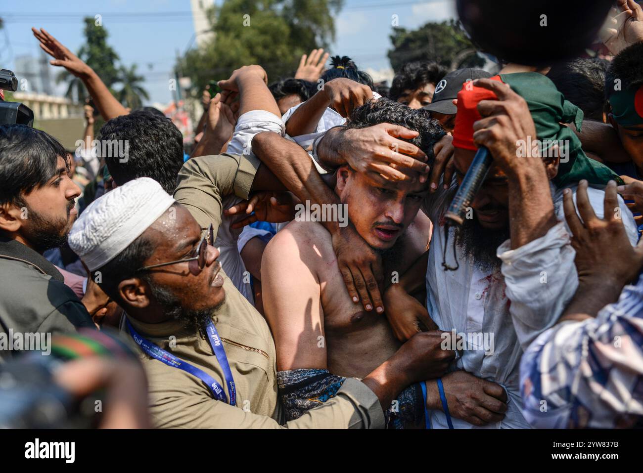 Students from anti-discrimination movements attack an Awami League supporter in Dhaka ...