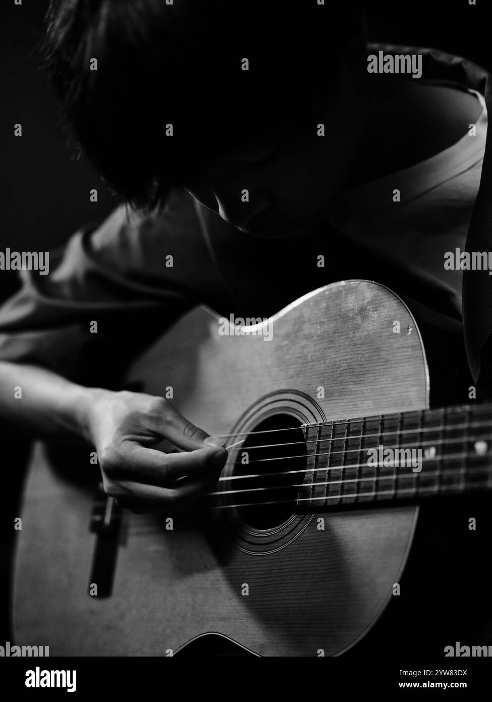 Acoustic guitar performance Black and White Stock Photos & Images - Alamy