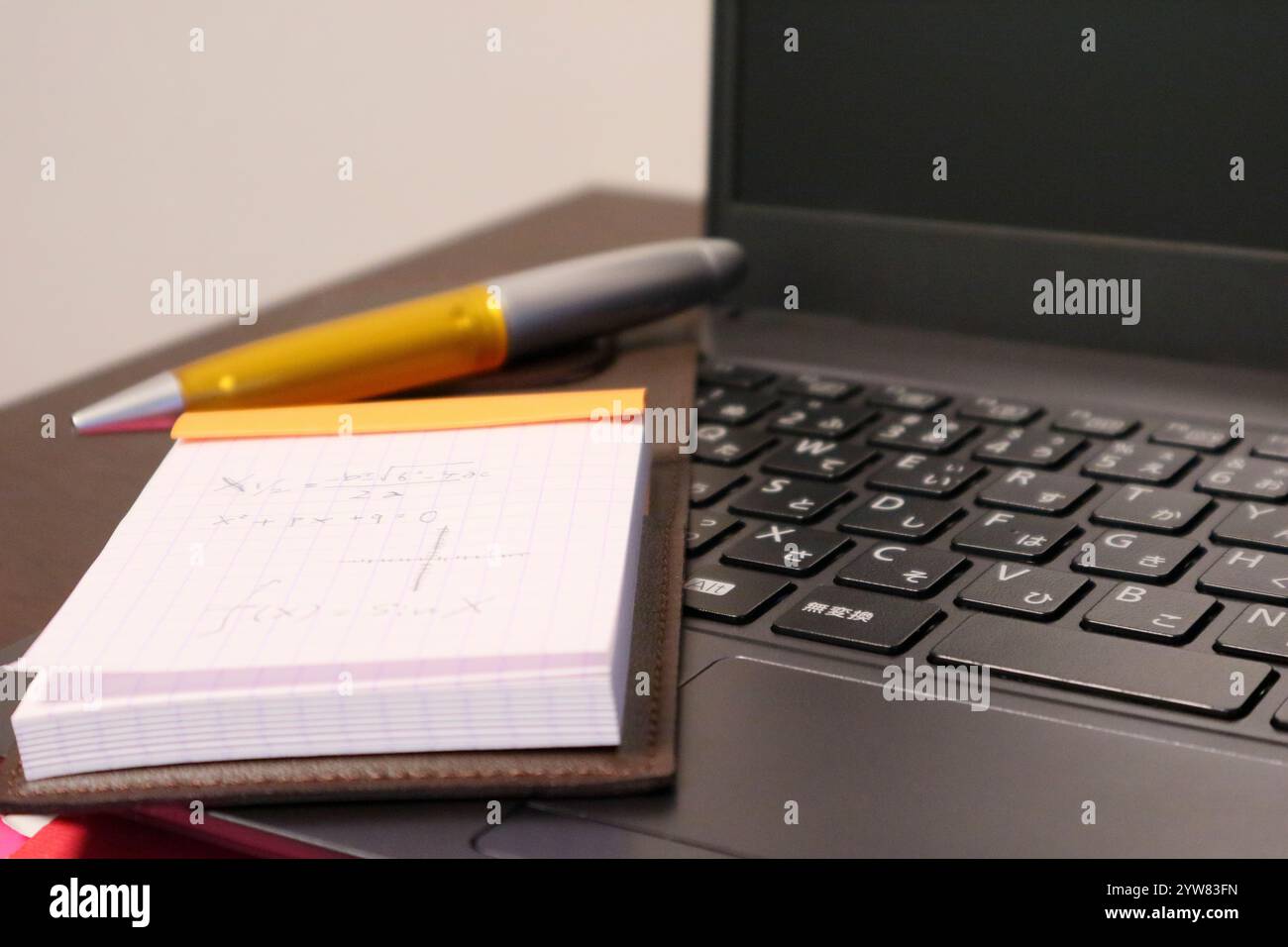 Notepad and pen on the PC Stock Photo - Alamy