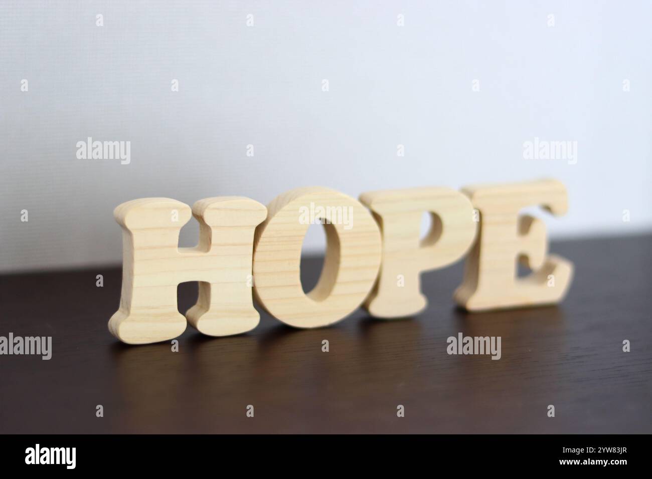 Wooden word blocks to represent the letters HOPE Stock Photo - Alamy