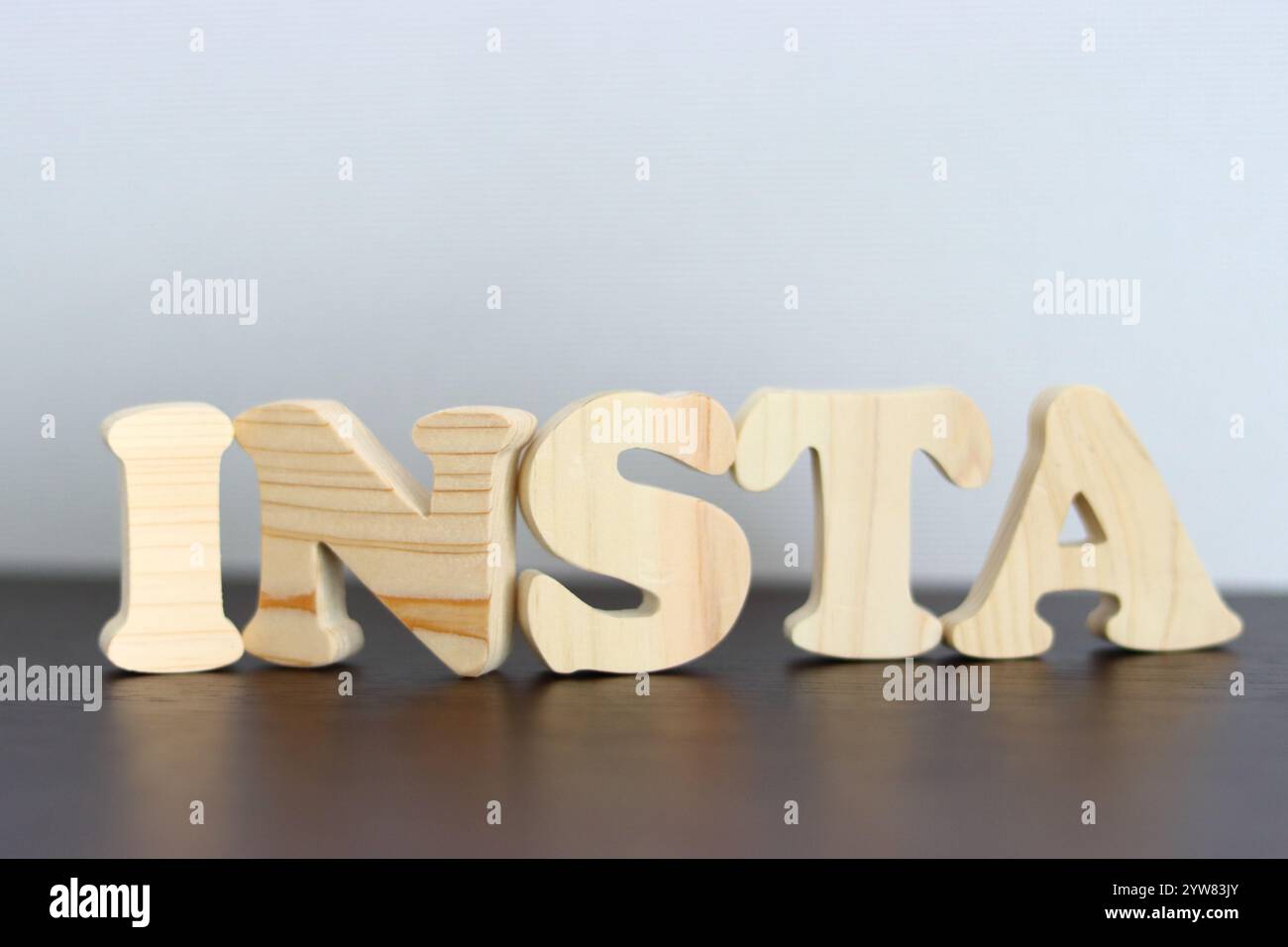 Wooden word blocks representing the letters INSTA Stock Photo - Alamy