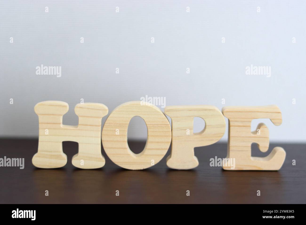 Wooden word blocks to represent the letters HOPE Stock Photo - Alamy
