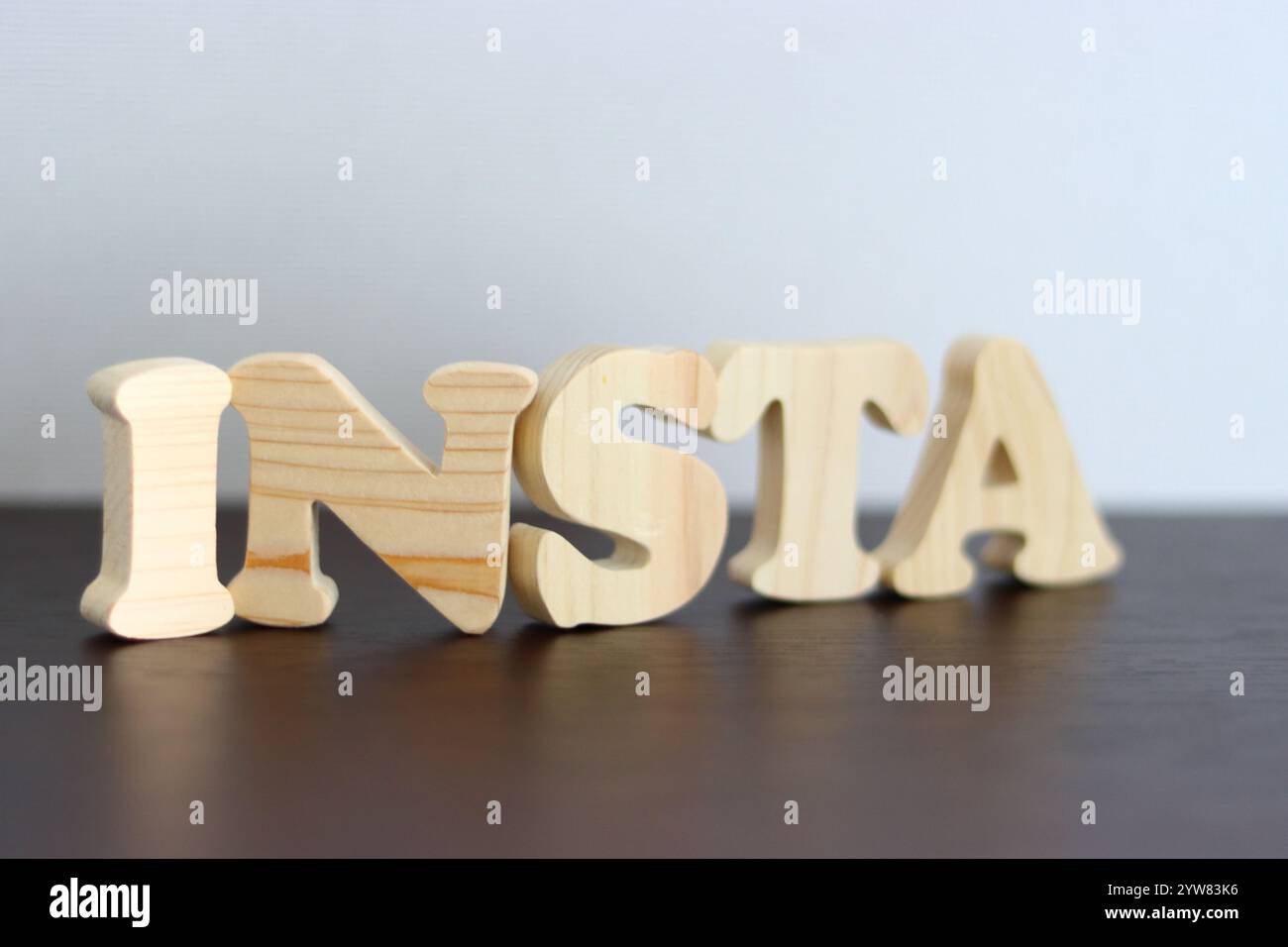 Wooden word blocks representing the letters INSTA Stock Photo - Alamy