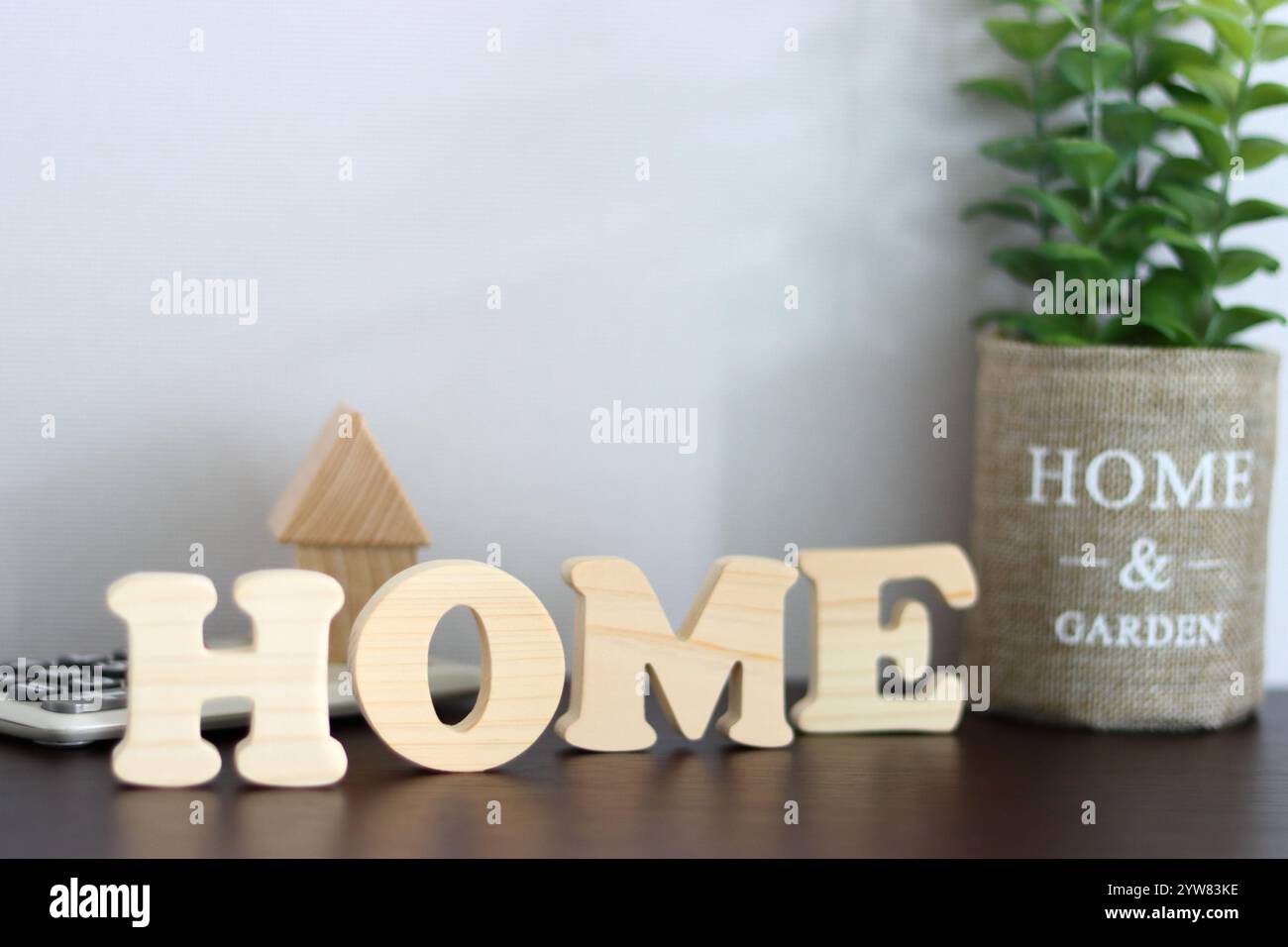 Wooden word blocks representing house-shaped blocks and the word HOME ...