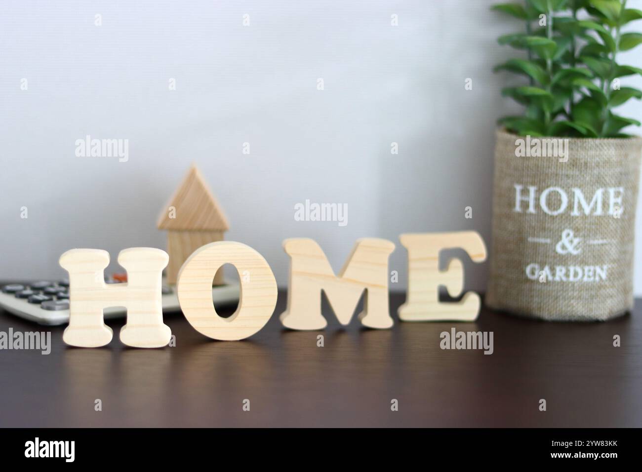 Wooden word blocks representing house-shaped blocks and the word HOME ...