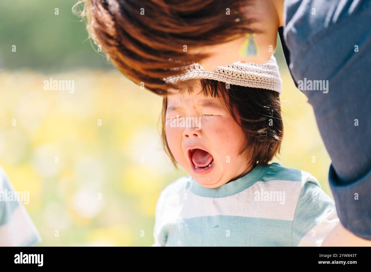Girl and mother crying in flower garden Stock Photo - Alamy