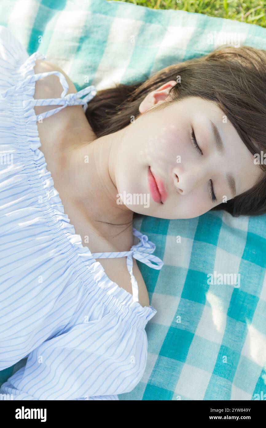 Young woman taking nap hi-res stock photography and images - Alamy