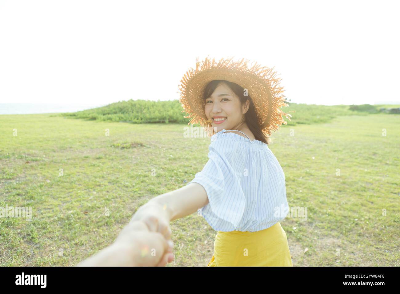 Woman pulling hands Stock Photo - Alamy