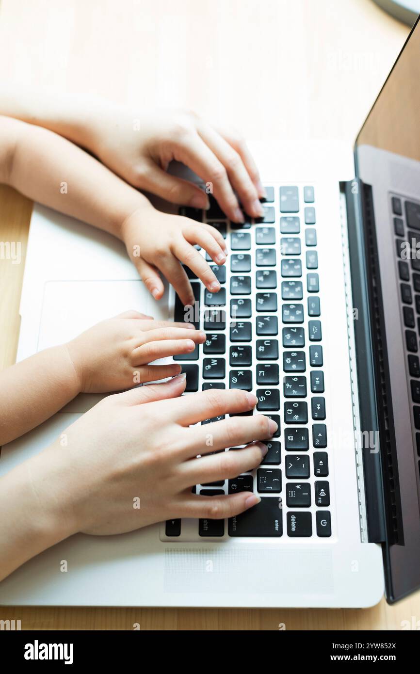 Child hand computer hi-res stock photography and images - Alamy