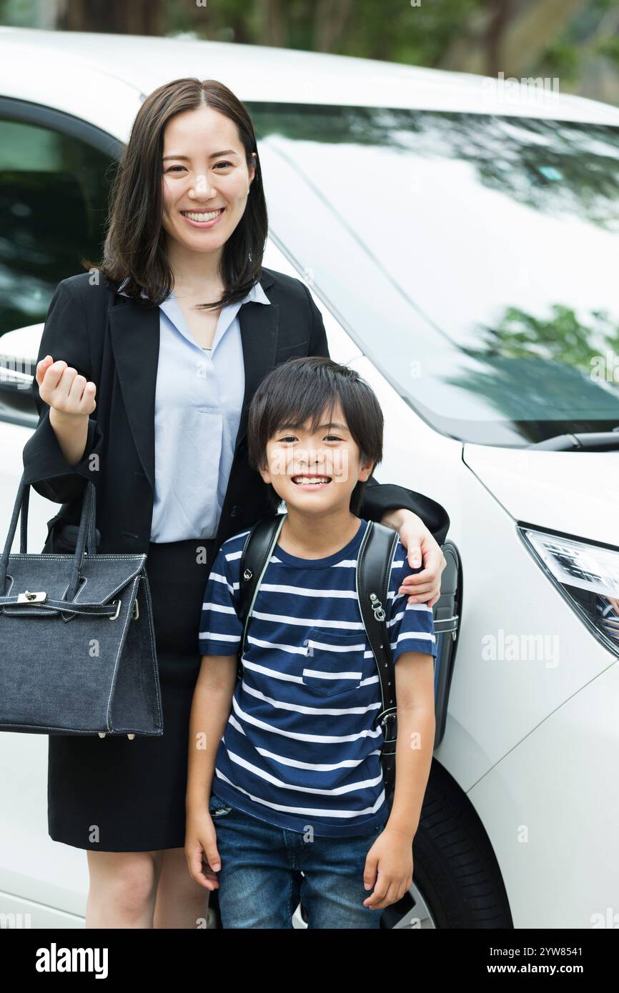 Woman driving her child to and from school Stock Photo - Alamy