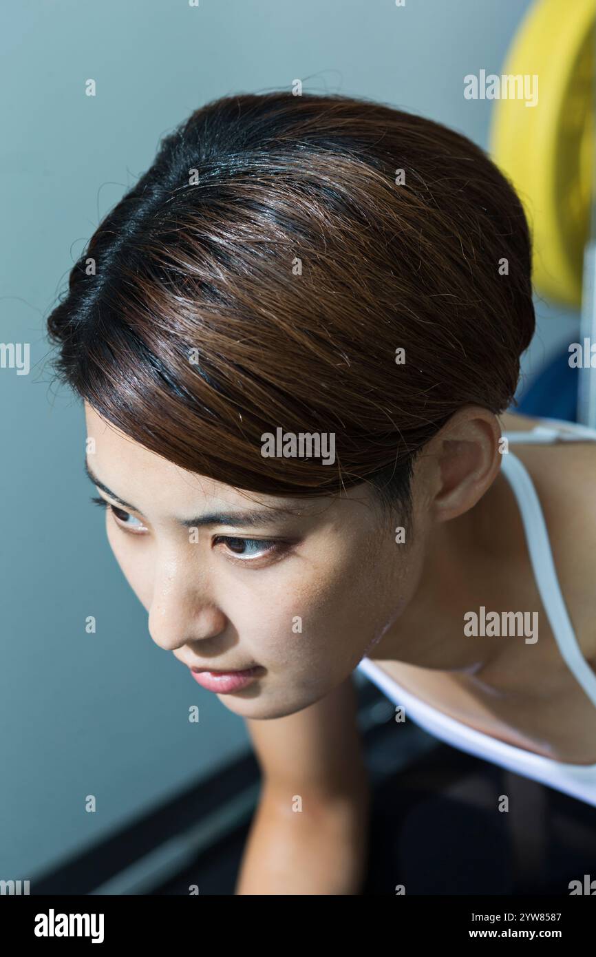 Facial expression of young women sweating at the gym Stock Photo - Alamy