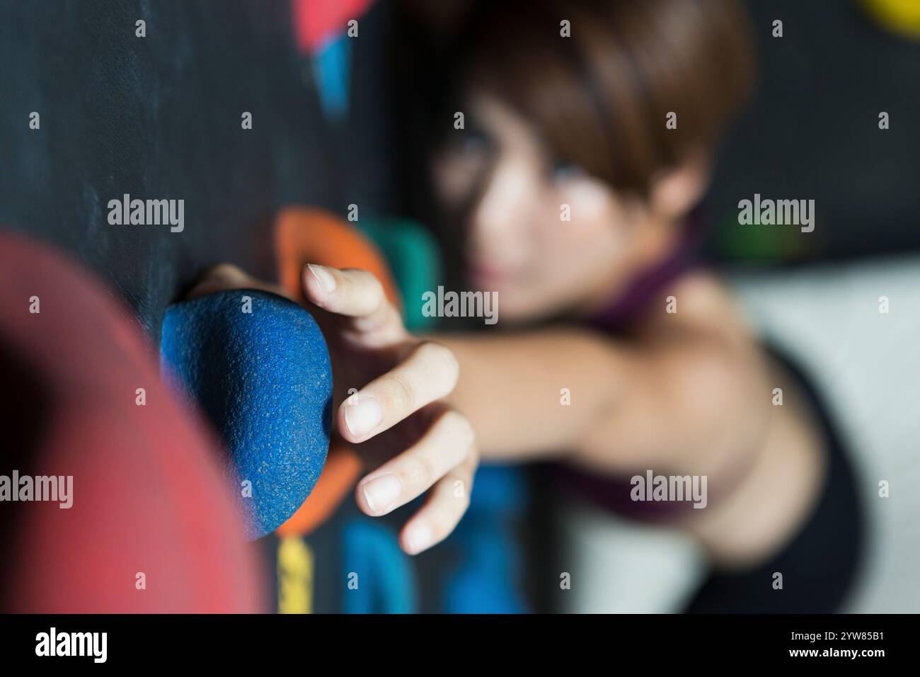 Young woman's hands bouldering Stock Photo - Alamy