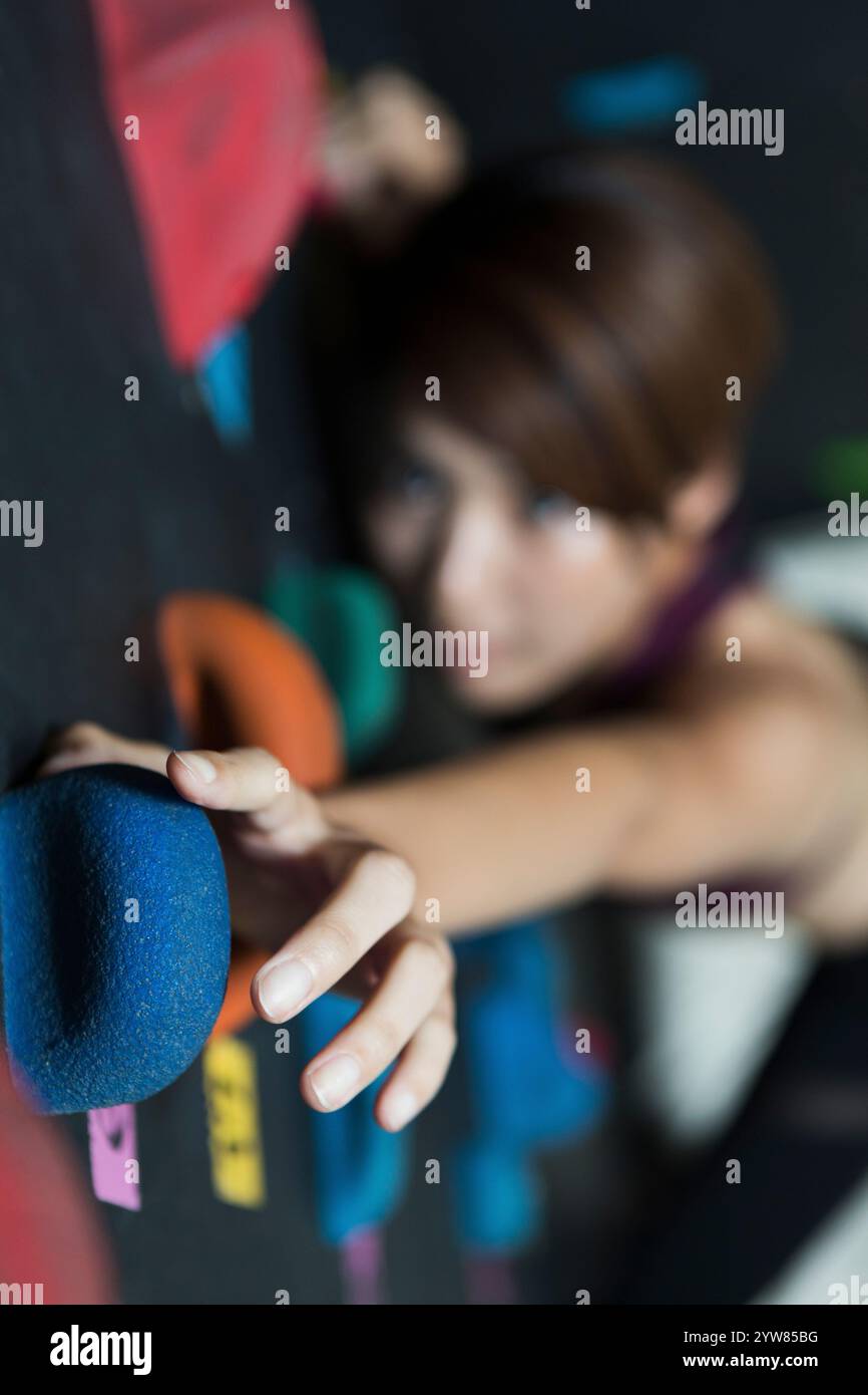Young woman's hands bouldering Stock Photo - Alamy