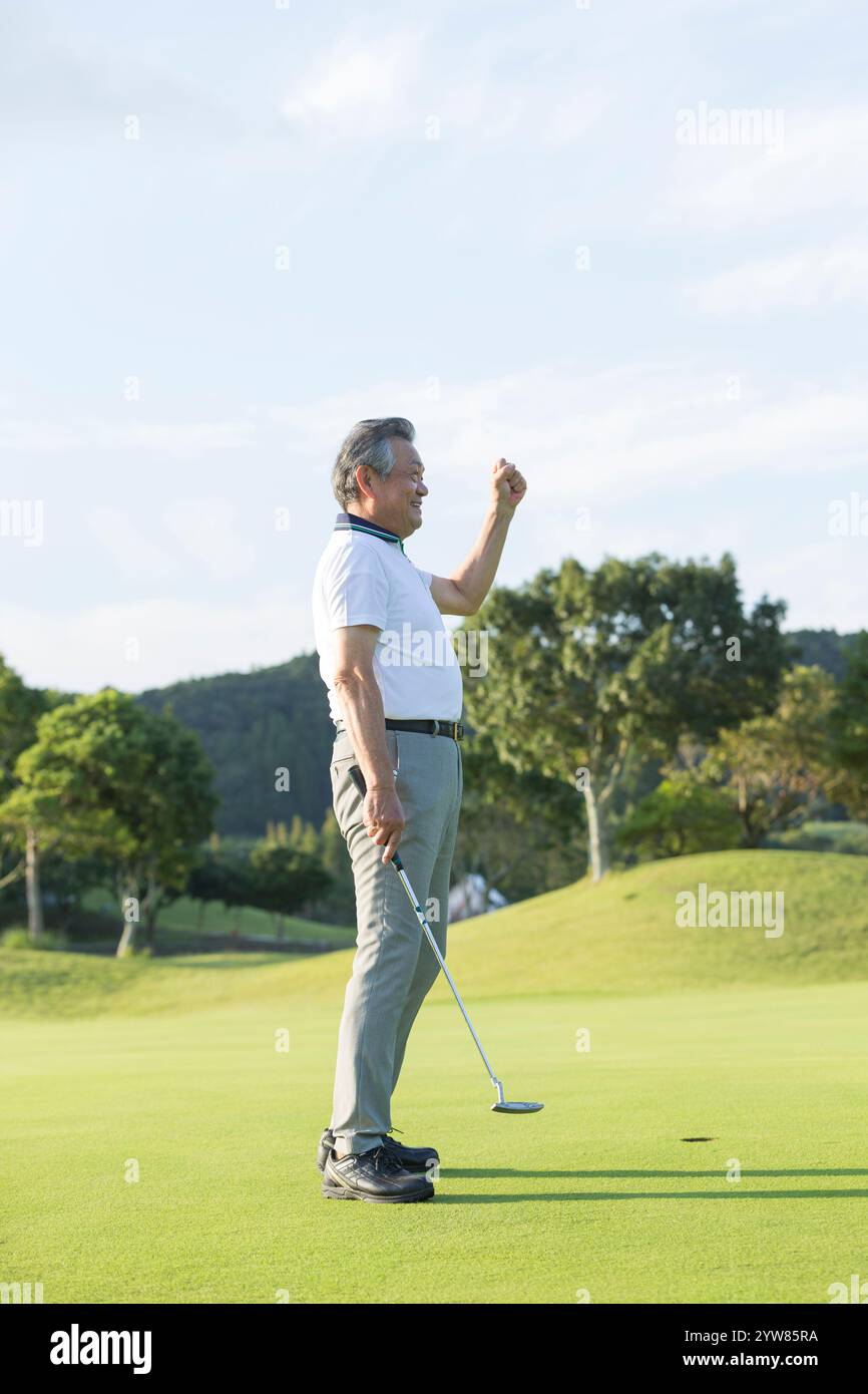 Senior men playing golf Stock Photo - Alamy