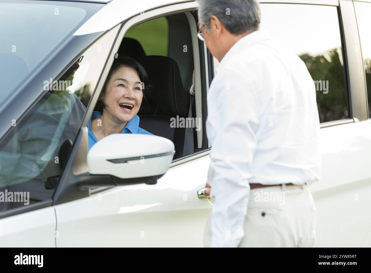 Senior couple enjoying a drive Stock Photo - Alamy