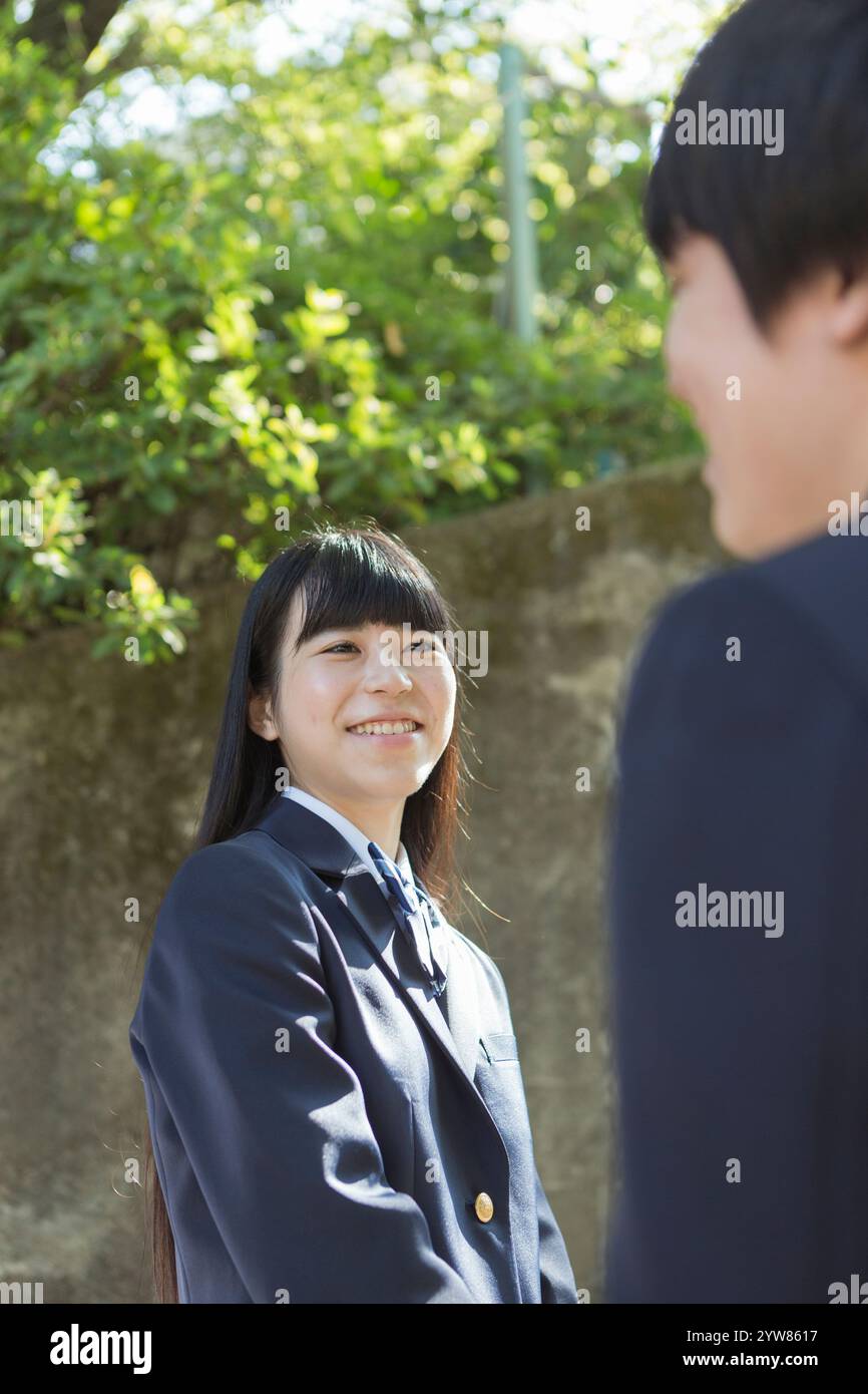 Smiling high school girls in conversation Stock Photo - Alamy