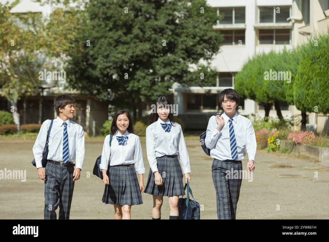 High school students leaving school Stock Photo - Alamy