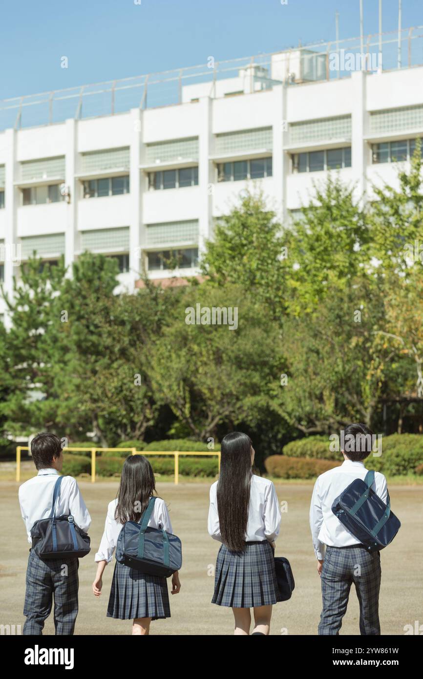 Back view of high school students on their way to school Stock Photo ...