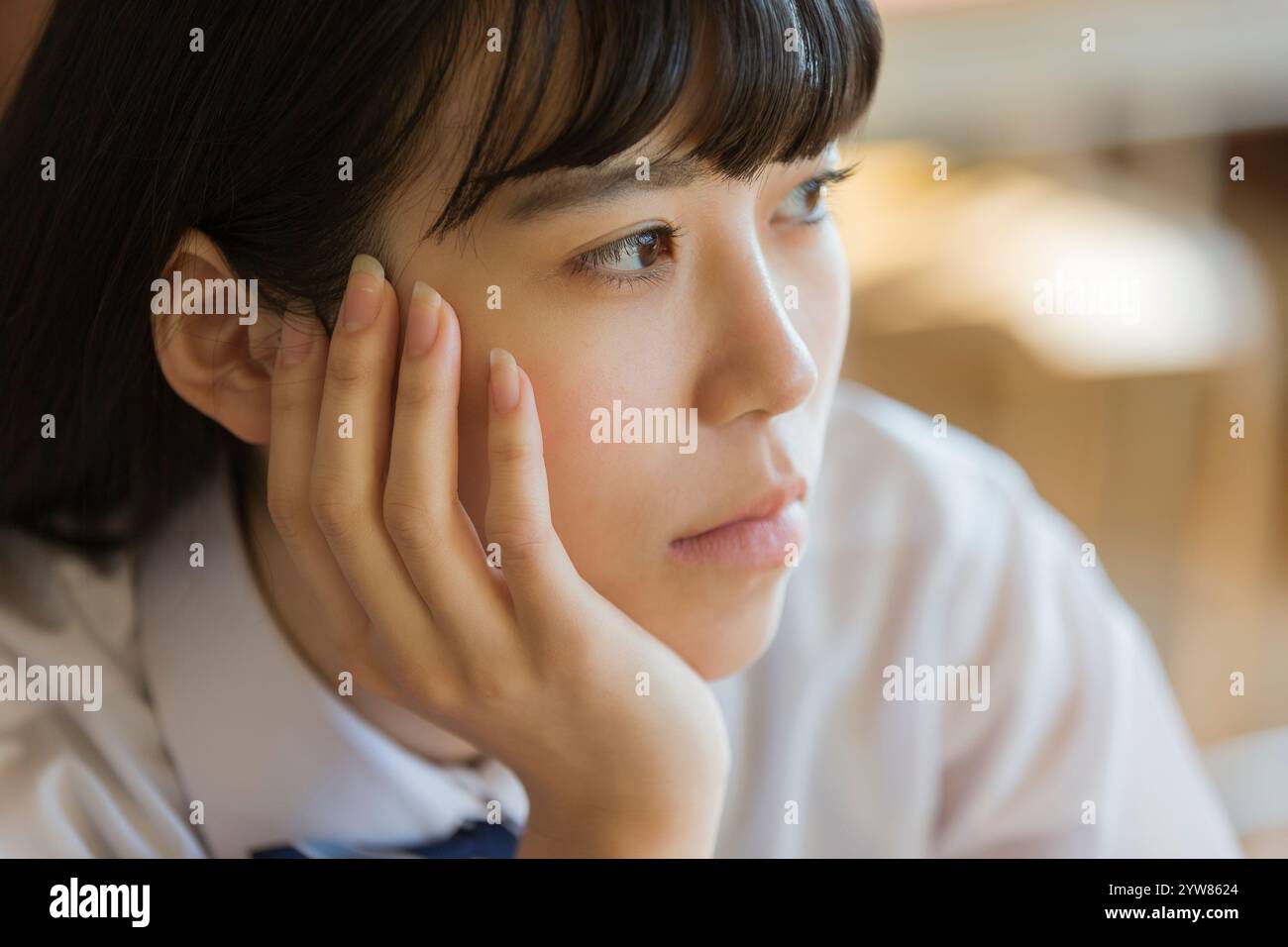 High school girl with cheekpieces Stock Photo - Alamy
