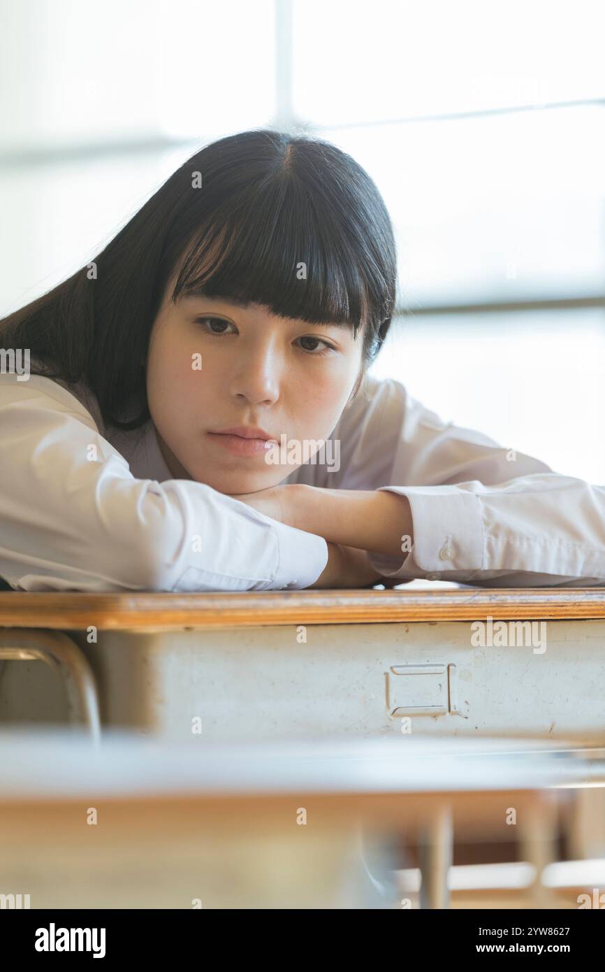 High school girl thinking Stock Photo - Alamy