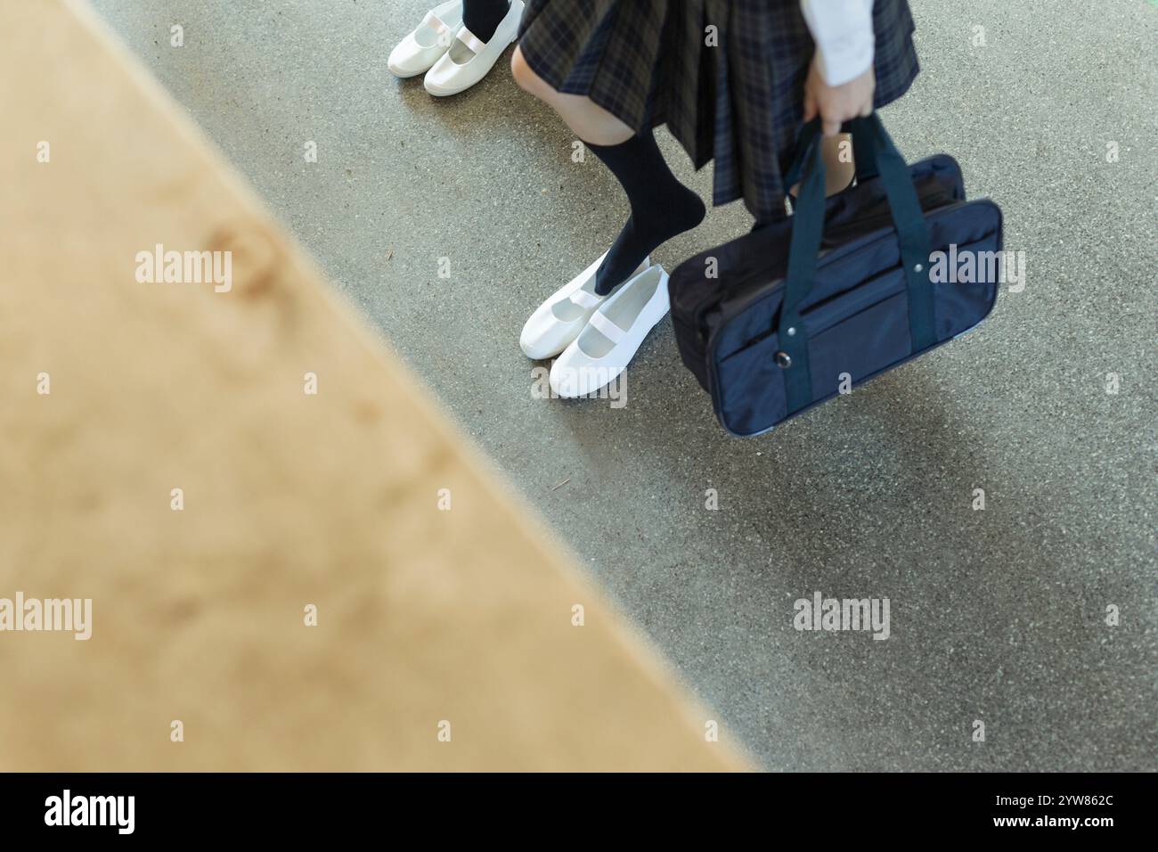 High school girls' feet wearing indoor shoes Stock Photo - Alamy
