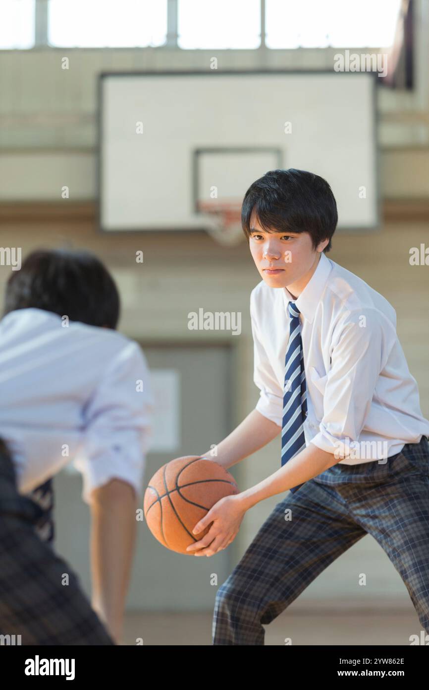 High school boys playing basketball Stock Photo - Alamy