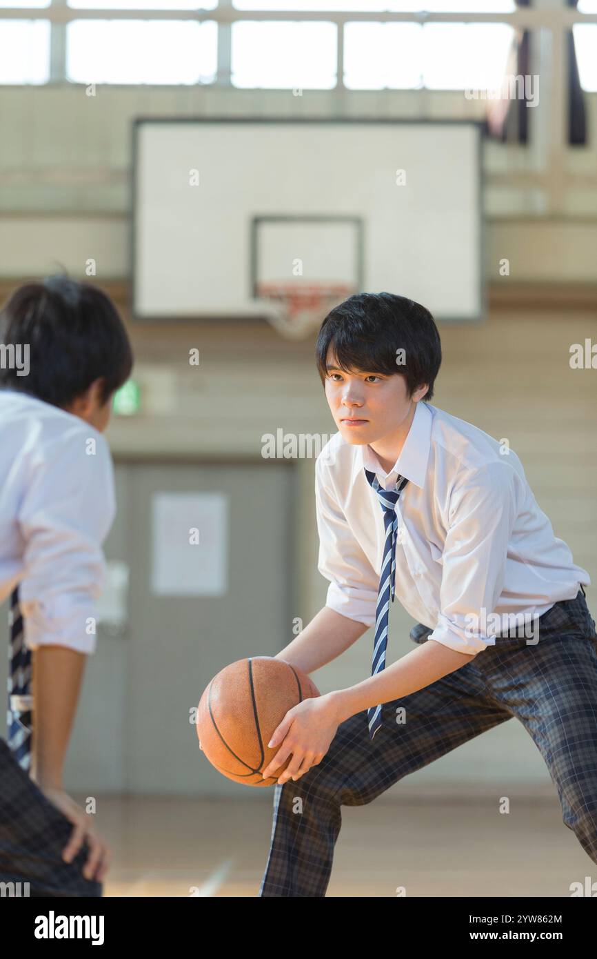 High school boys playing basketball Stock Photo - Alamy
