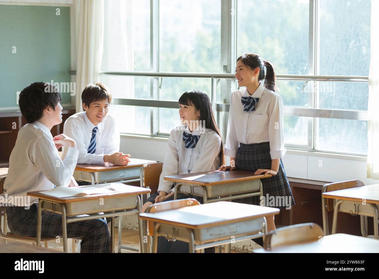 High school students talking in classroom Stock Photo - Alamy