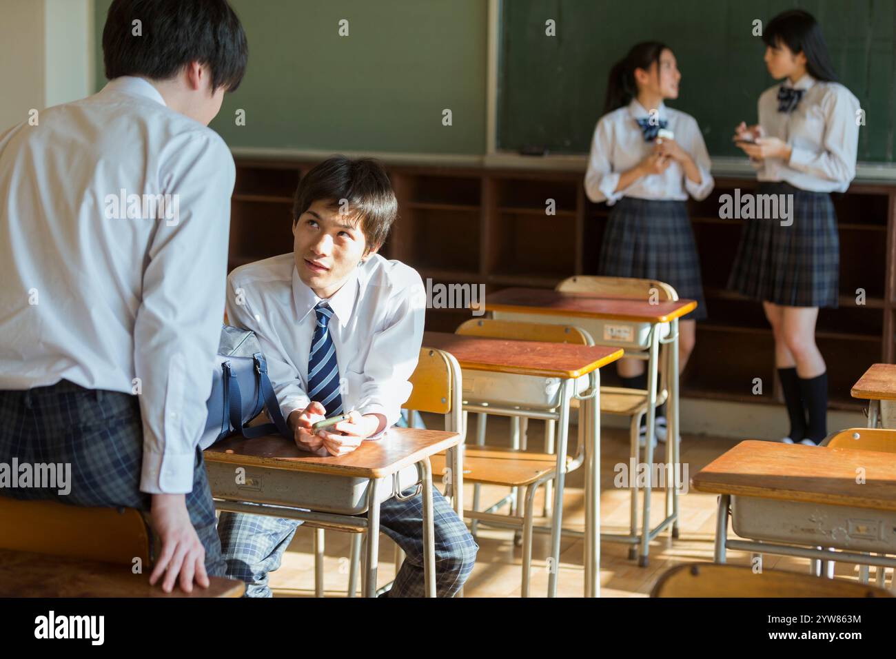 High school student operating a smartphone in the classroom Stock Photo ...