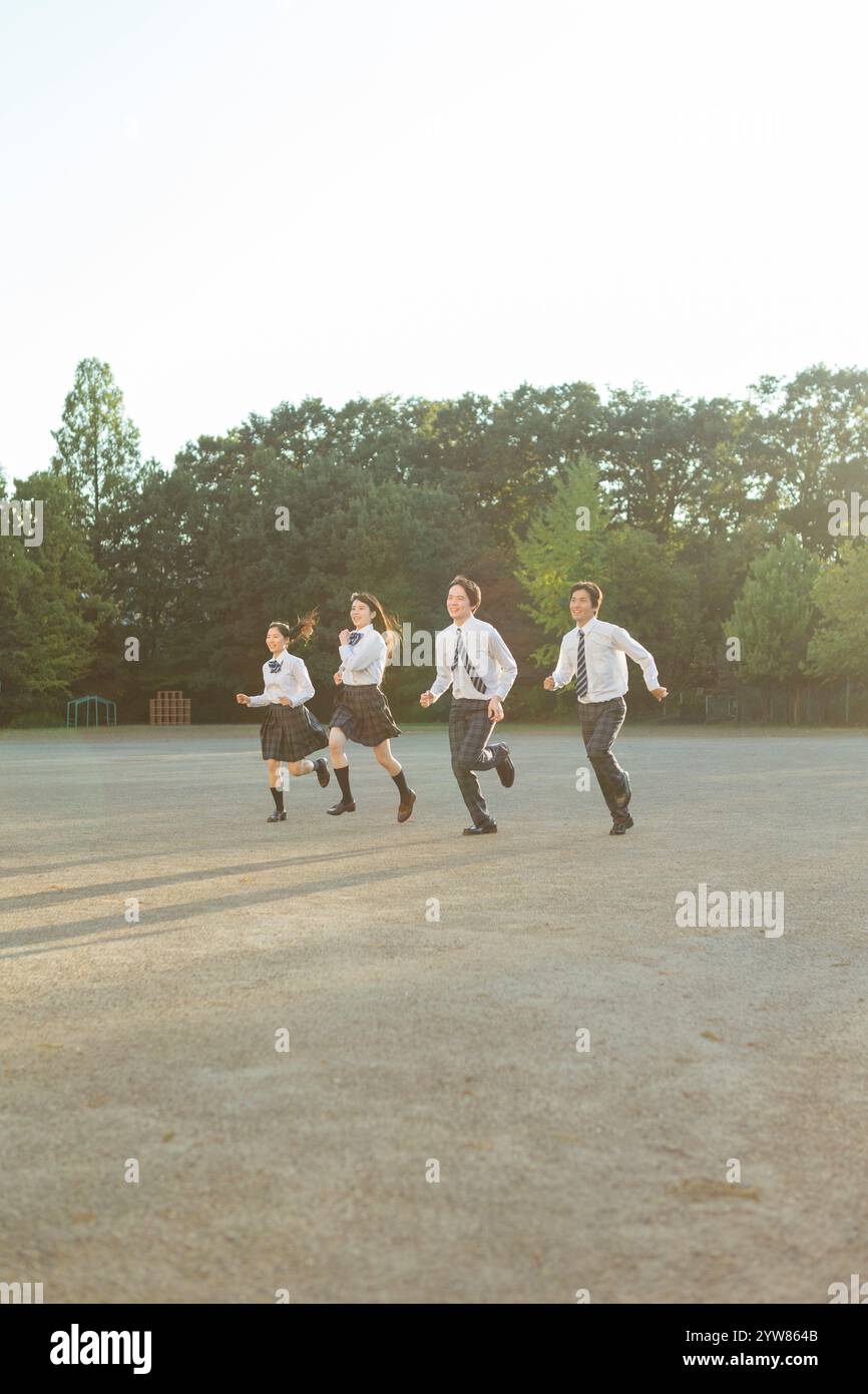 High school students running in the school yard Stock Photo - Alamy