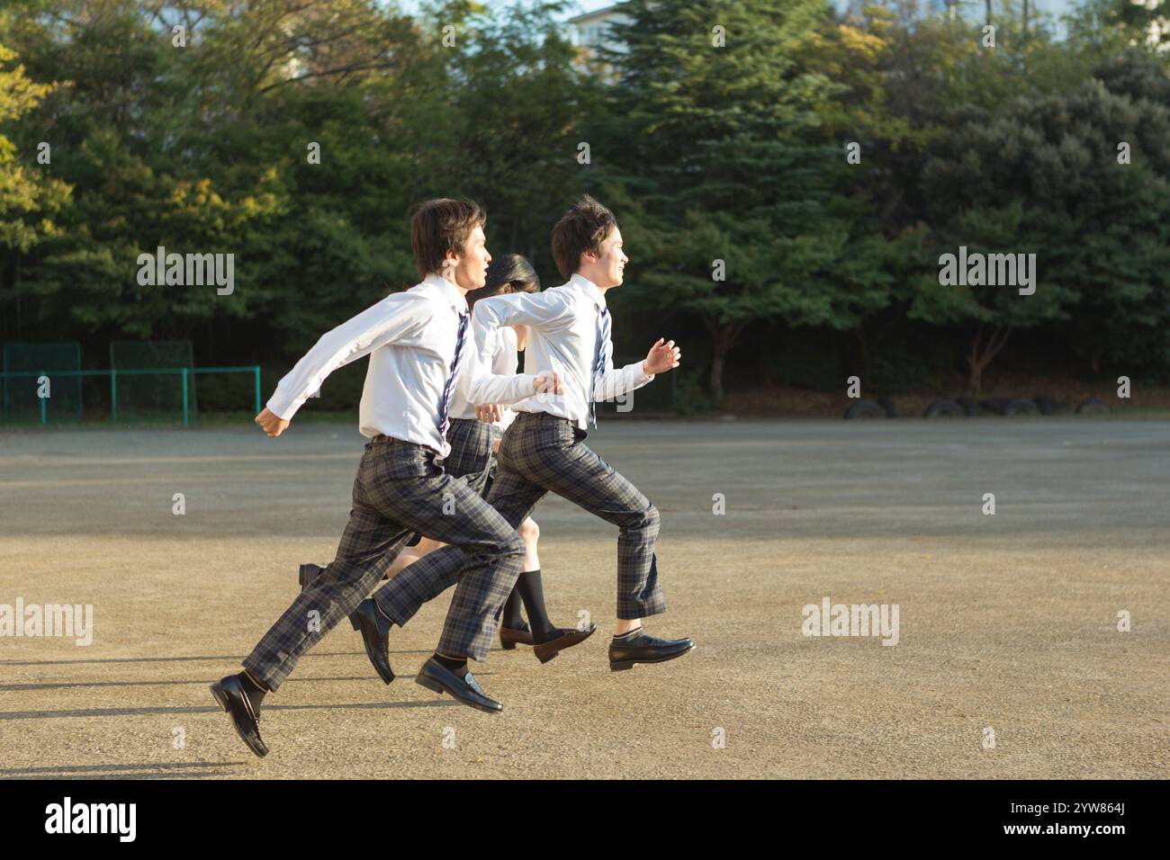 High school students running in the school yard Stock Photo - Alamy