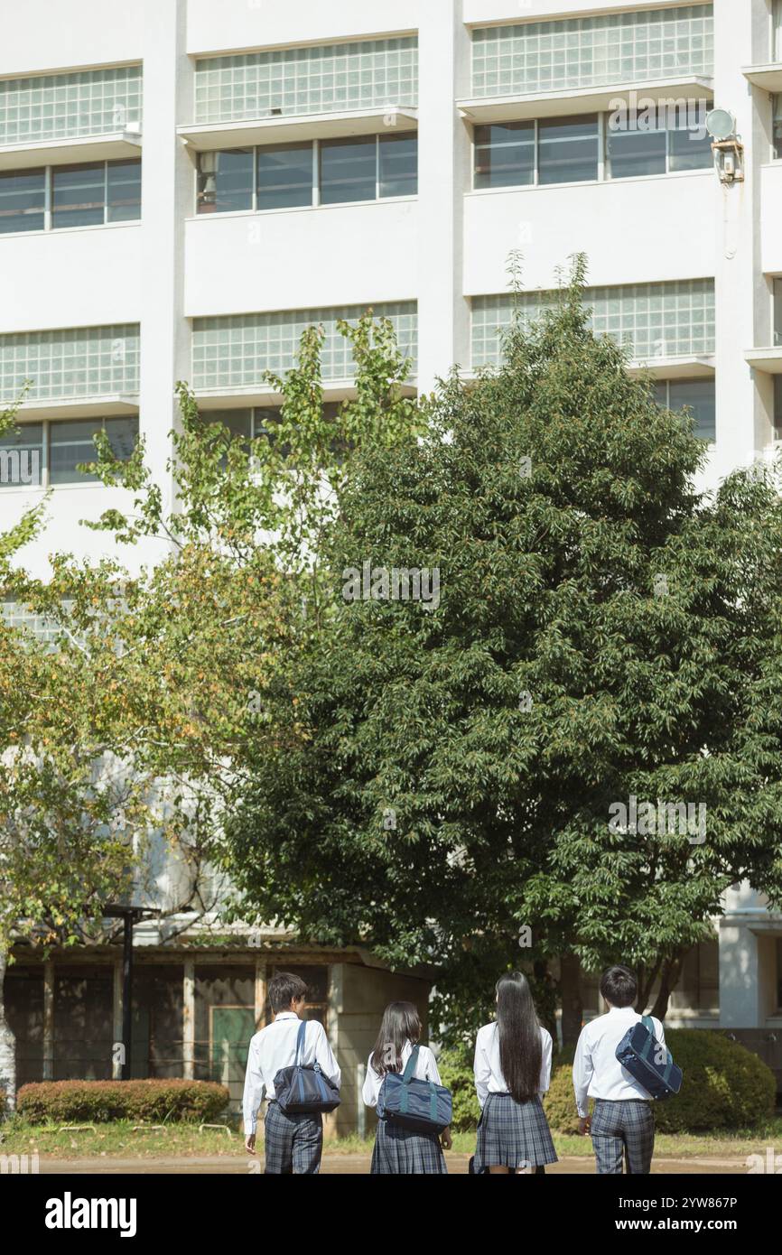 Back view of high school students on their way to school Stock Photo ...