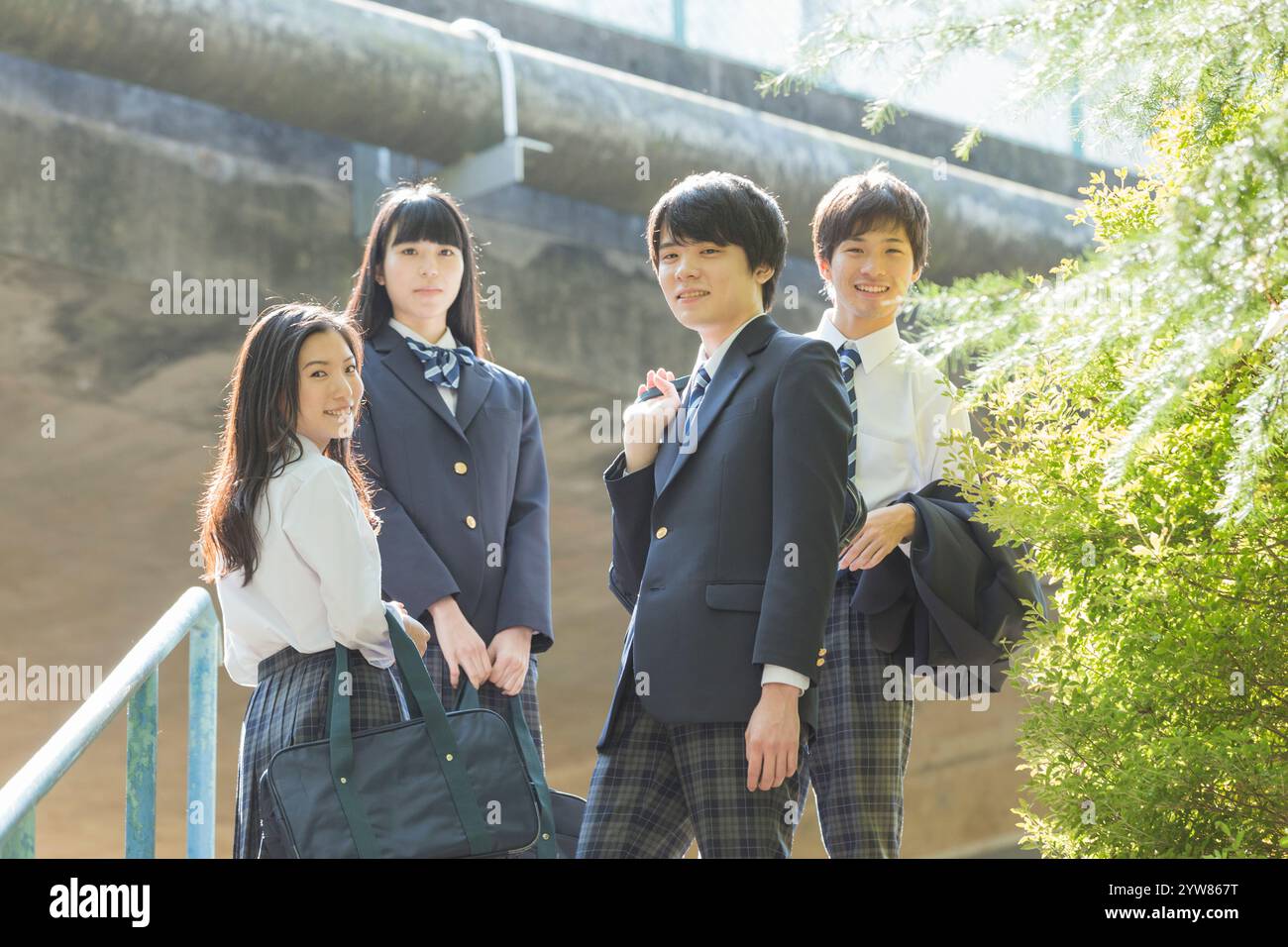 Portrait of high school students on their way to school Stock Photo - Alamy