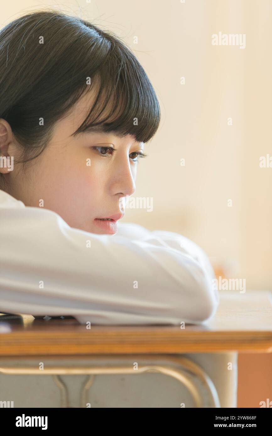 High school girl thinking Stock Photo - Alamy
