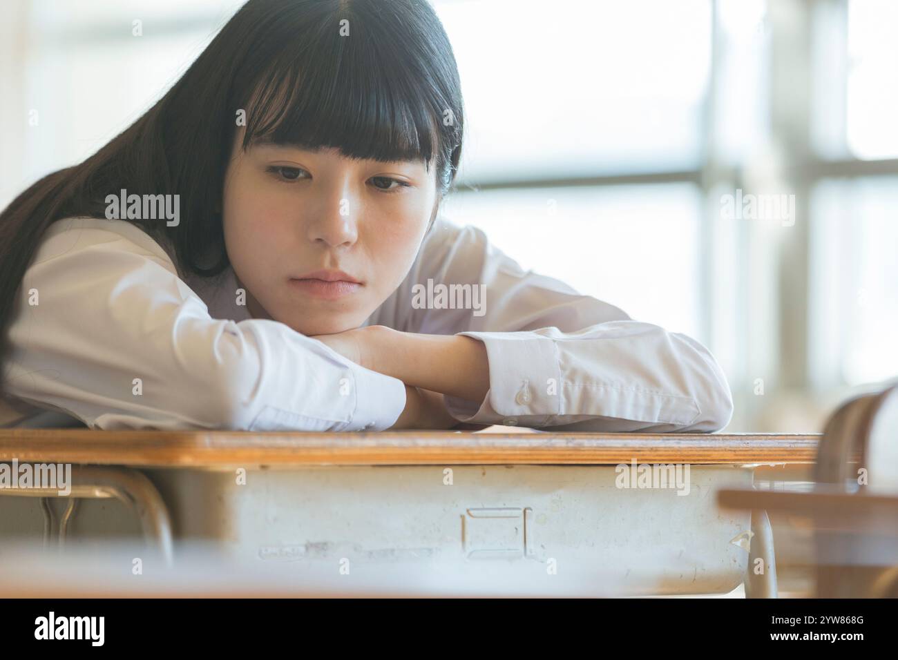 High school girl thinking Stock Photo - Alamy