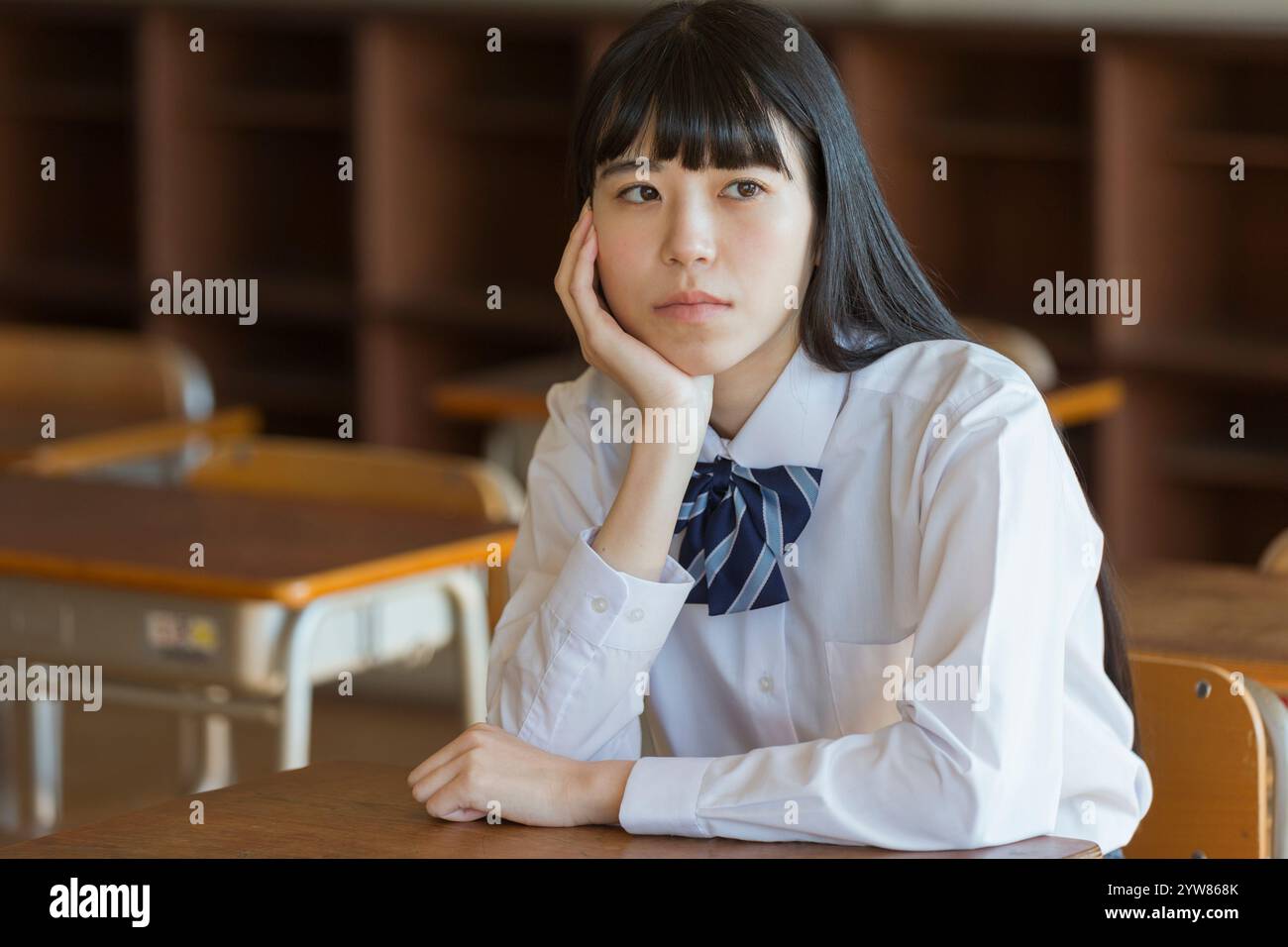High school girl with cheekpieces Stock Photo - Alamy