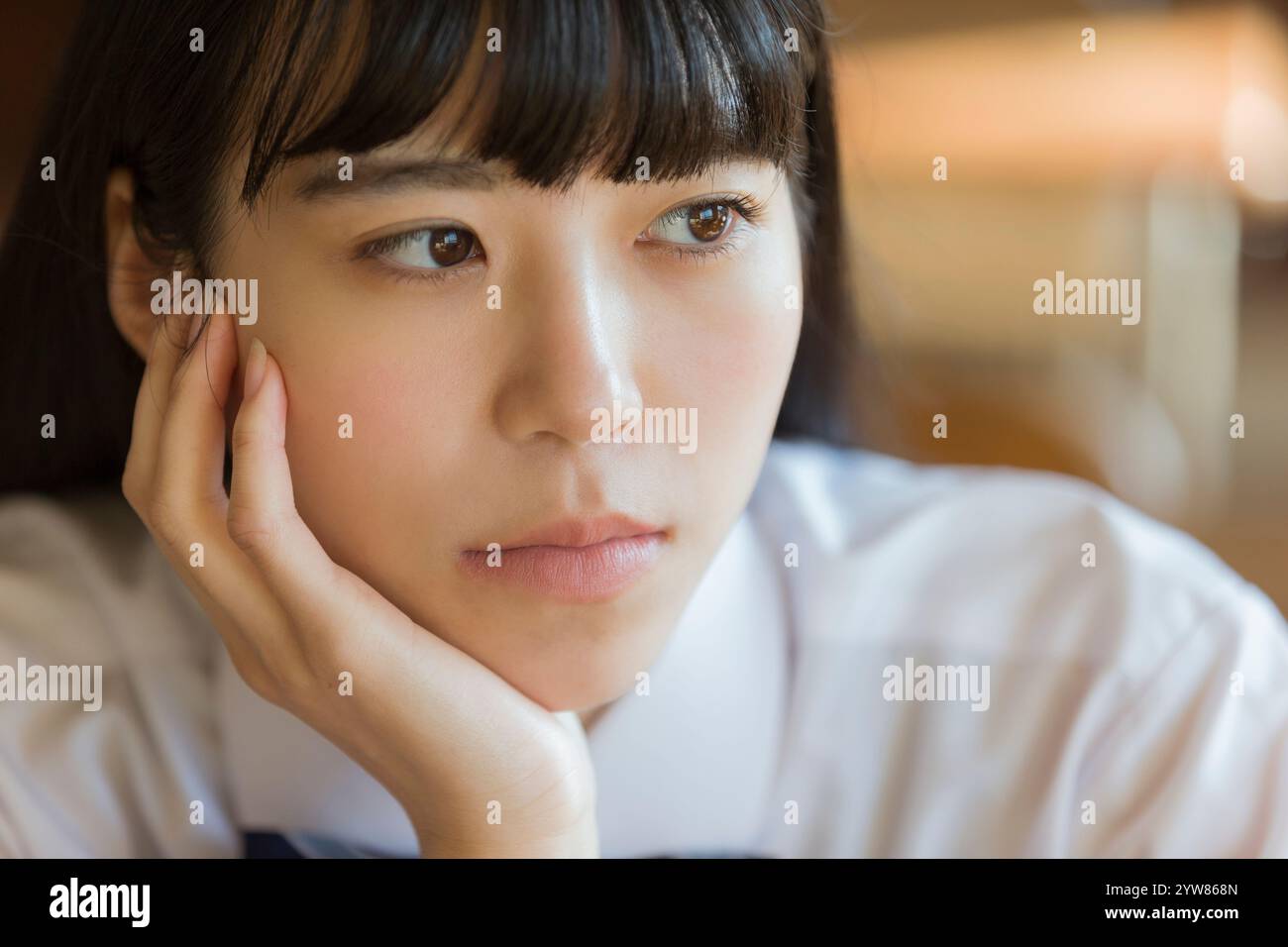 High school girl with cheekpieces Stock Photo - Alamy