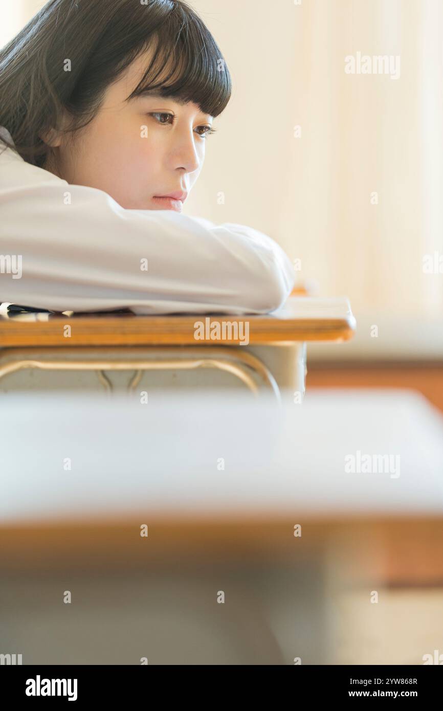 High school girl thinking Stock Photo - Alamy