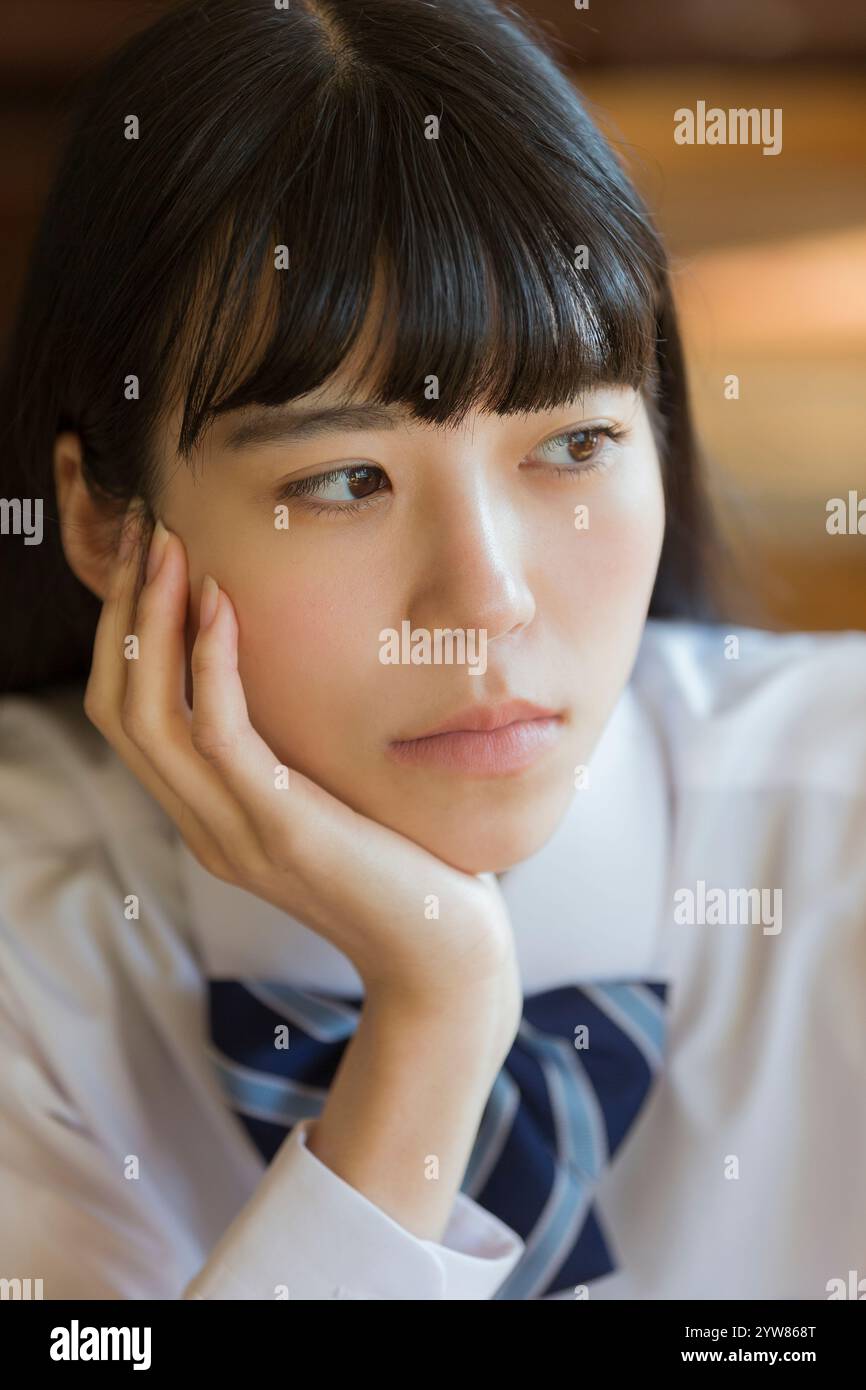 High school girl with cheekpieces Stock Photo - Alamy