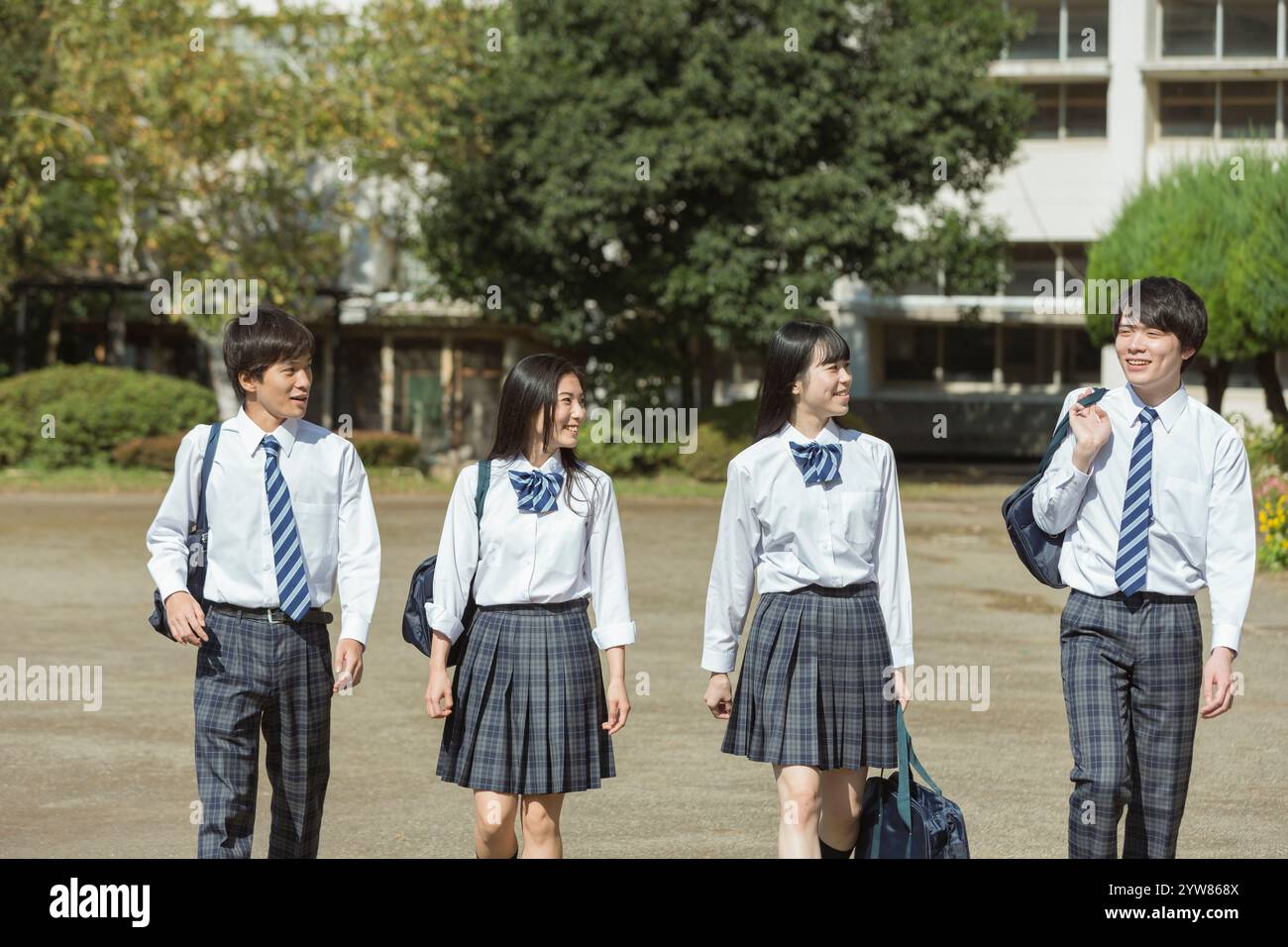 High school students leaving school Stock Photo - Alamy