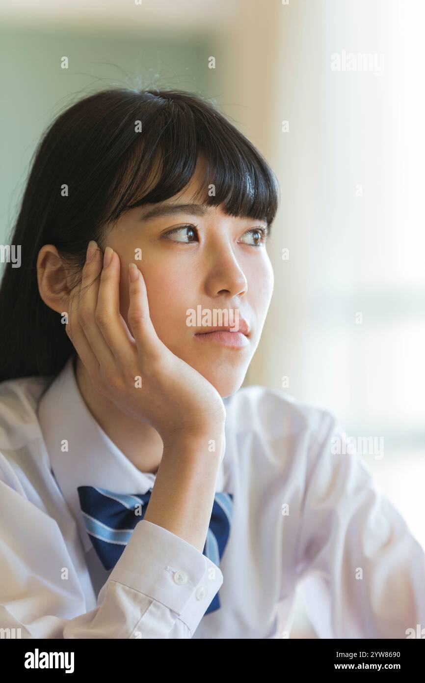 High school girl with cheekpieces Stock Photo - Alamy