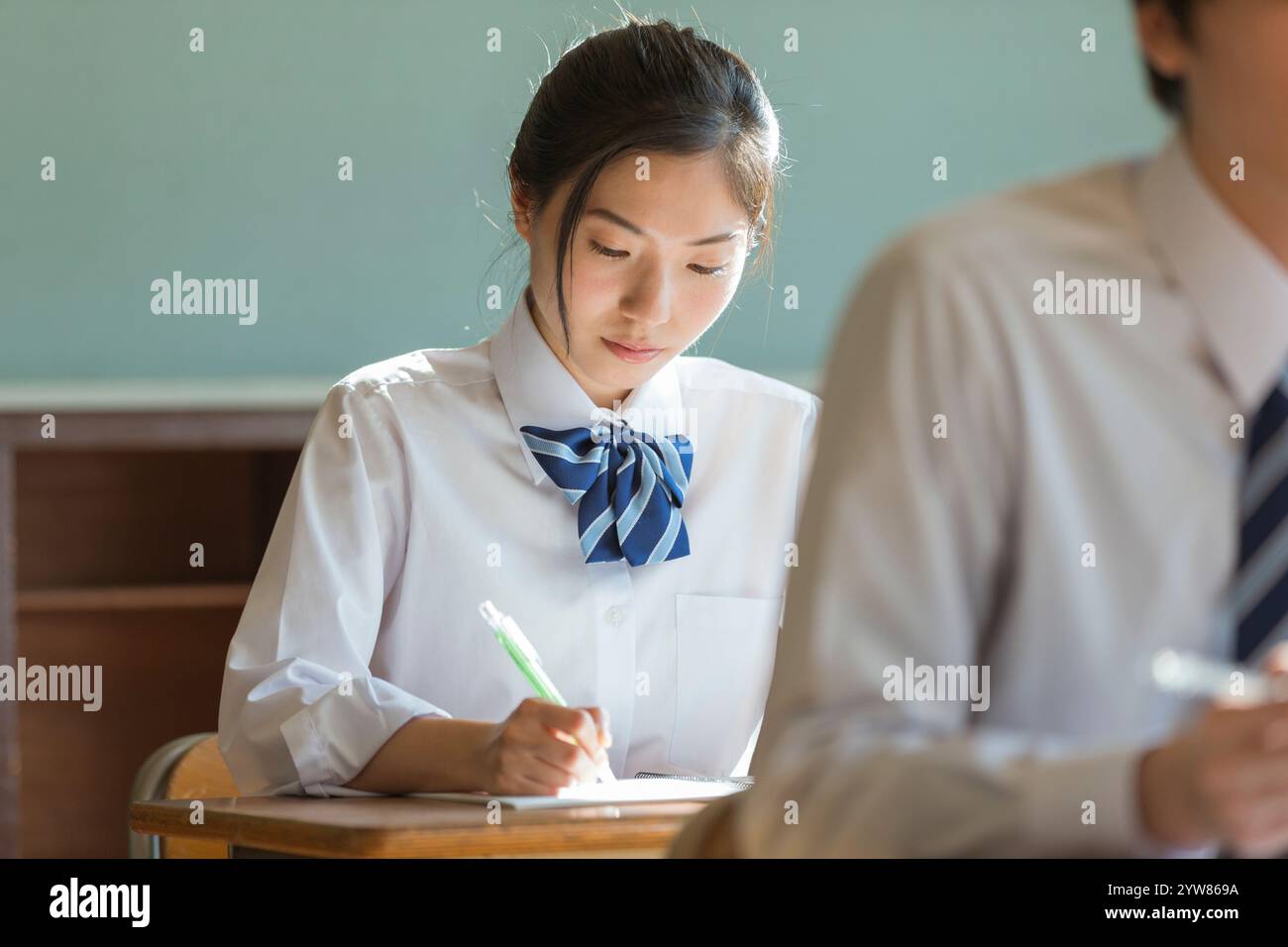 High school girls studying in a classroom Stock Photo - Alamy