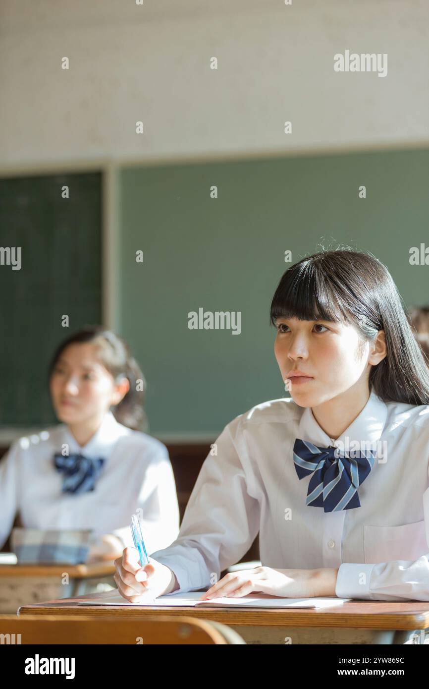 High school girls studying in a classroom Stock Photo - Alamy